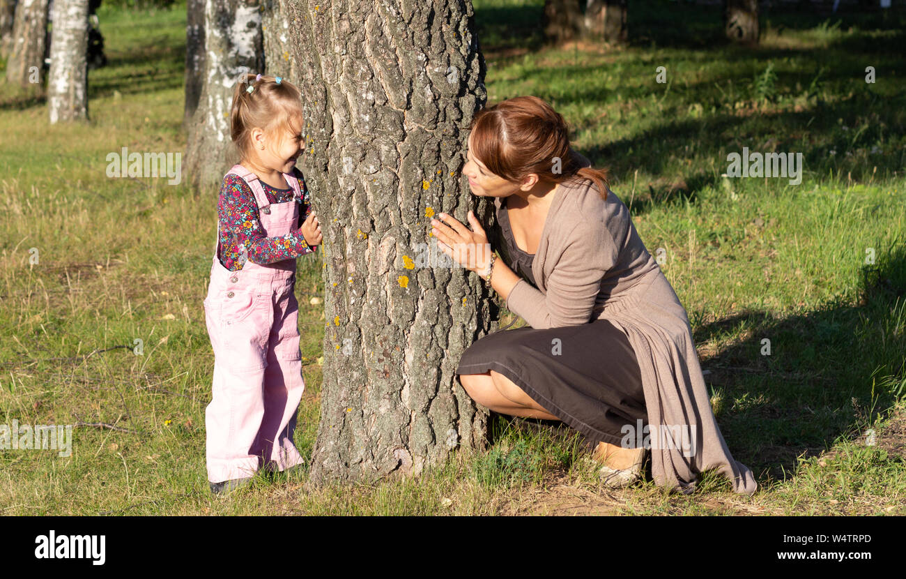Child Hiding Behind Mother