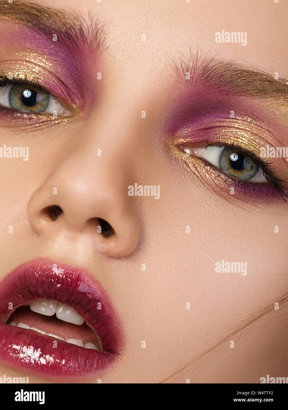Close up beauty portrait of young woman with modern salon makeup ...