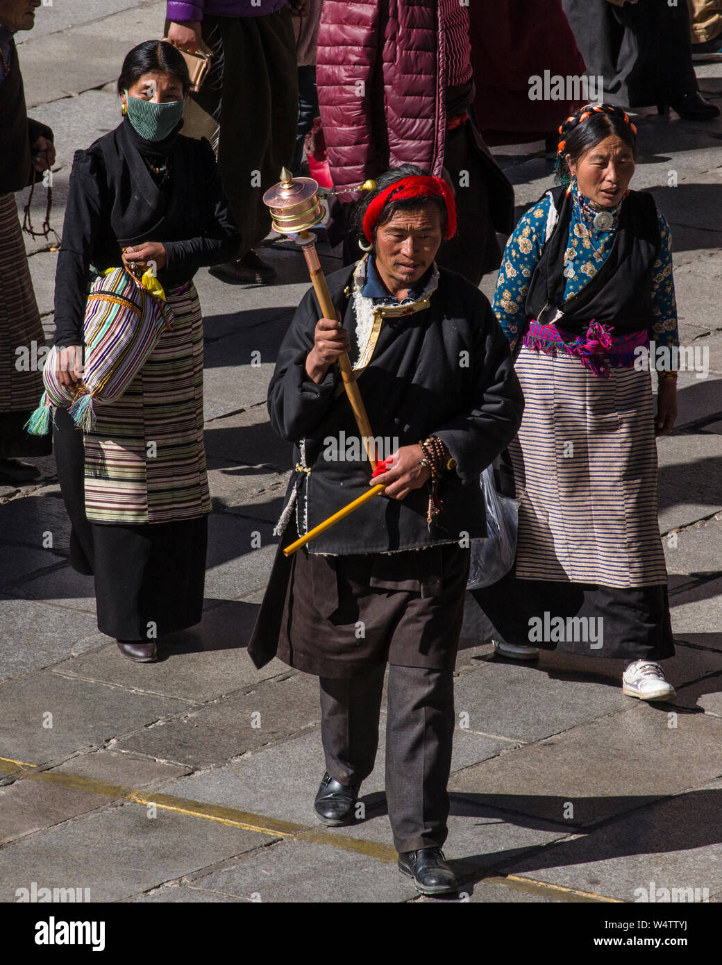 China, Tibet, Lhasa, Tibetan Buddhist pilgrims from the Kham region of ...
