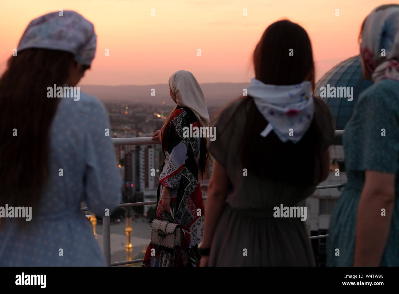 Chechen women gazing from an observation point of a skyscraper in ...