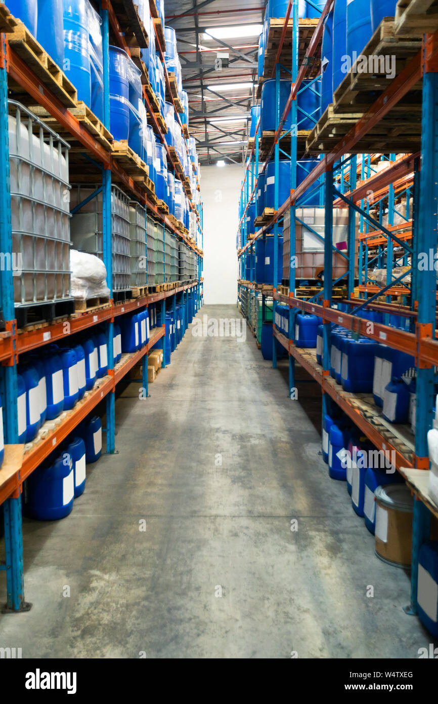 Barrel and crates on a rack in warehouse Stock Photo - Alamy