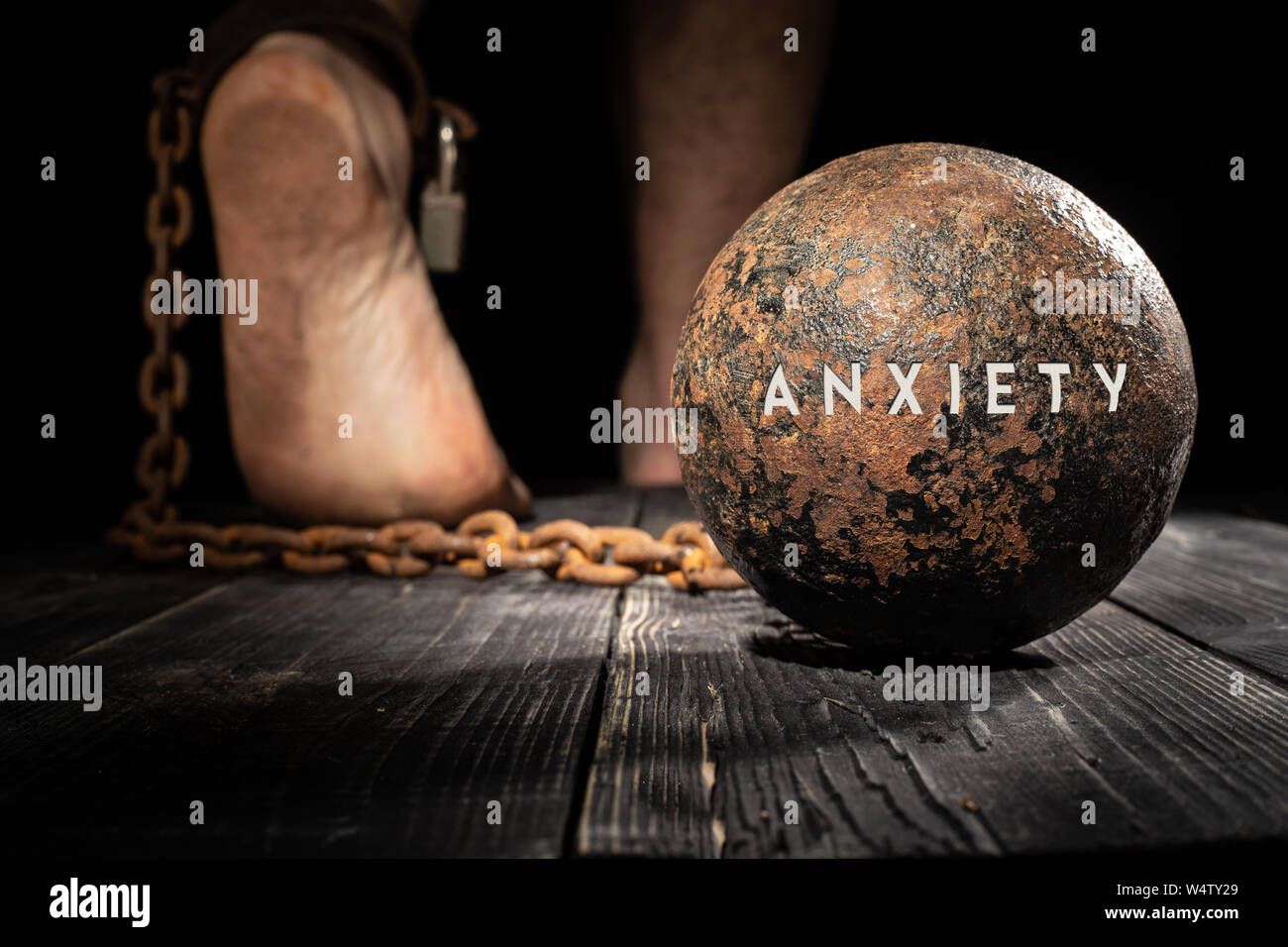 Ball and chain of fear hi-res stock photography and images - Alamy