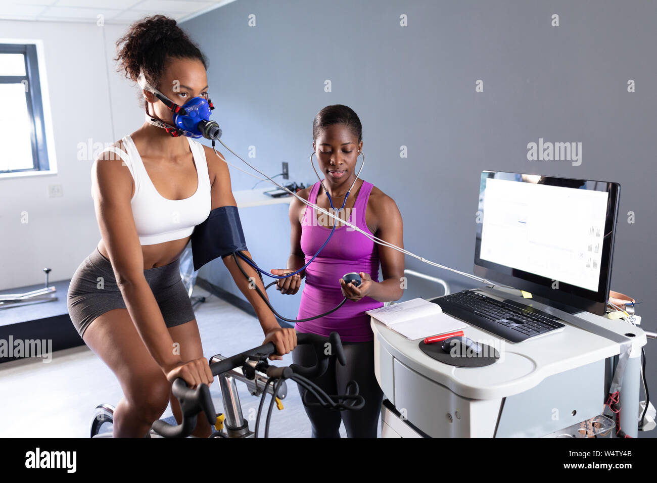 Woman doing a fitness test Stock Photo - Alamy