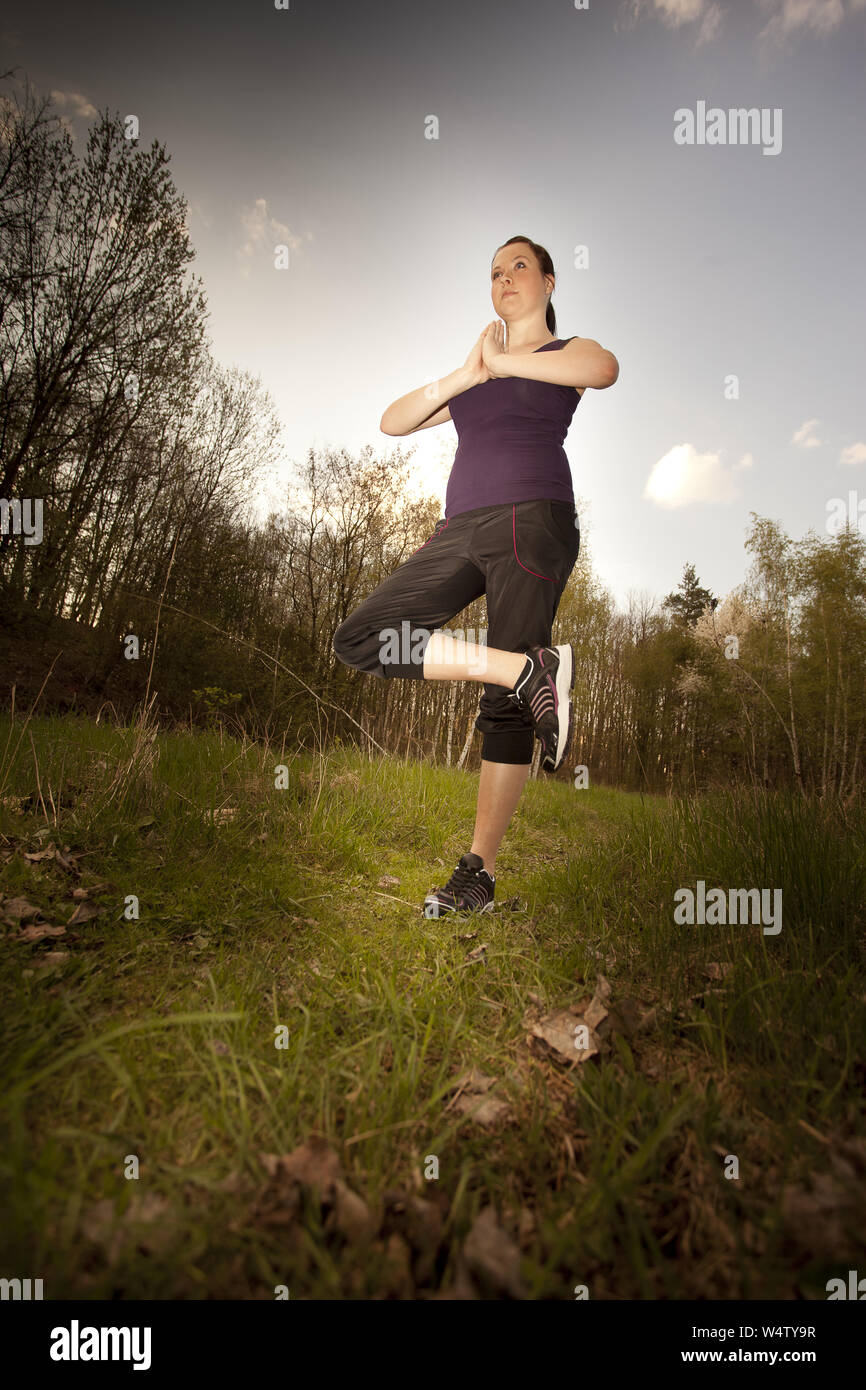 Yoga on hill slim woman hi-res stock photography and images - Alamy