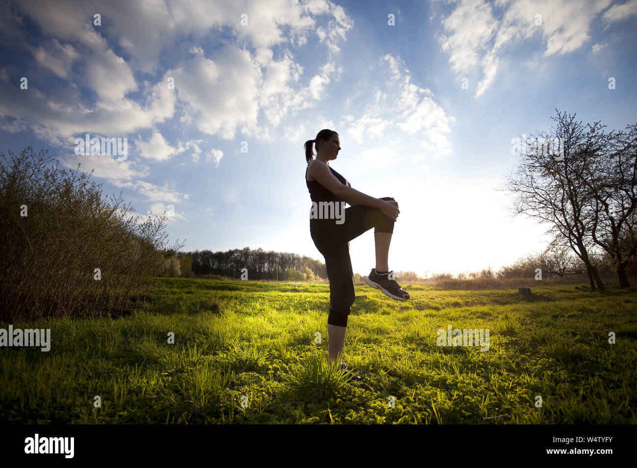 Yoga on hill slim woman hi-res stock photography and images - Alamy