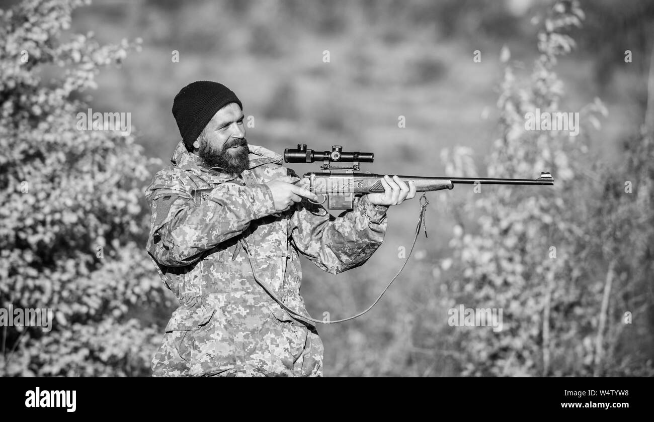 Hunter hold rifle. Bearded hunter spend leisure hunting. Focus and ...