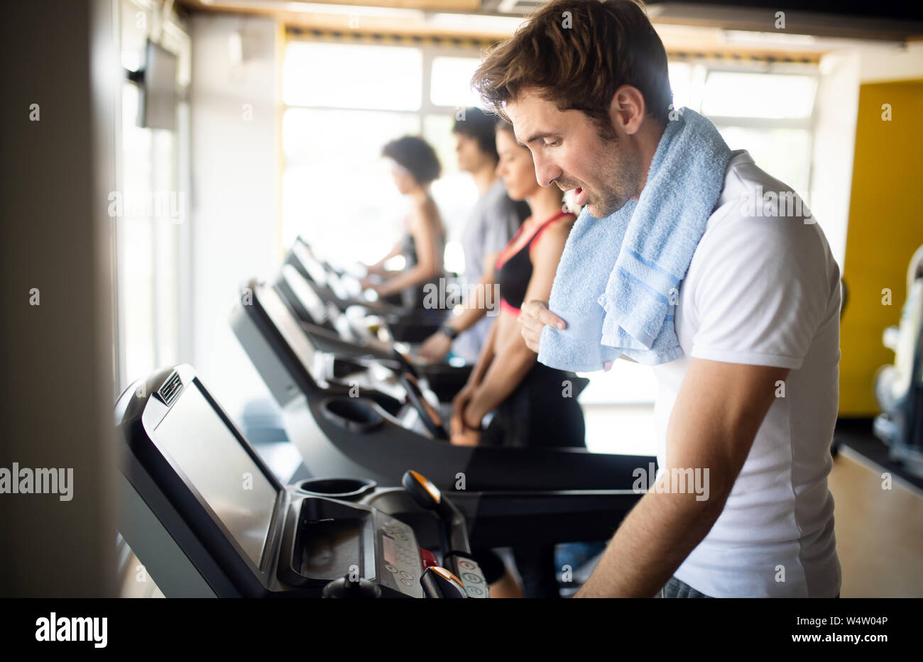 Lifestyle portrait of handsome muscular man after the training in the ...