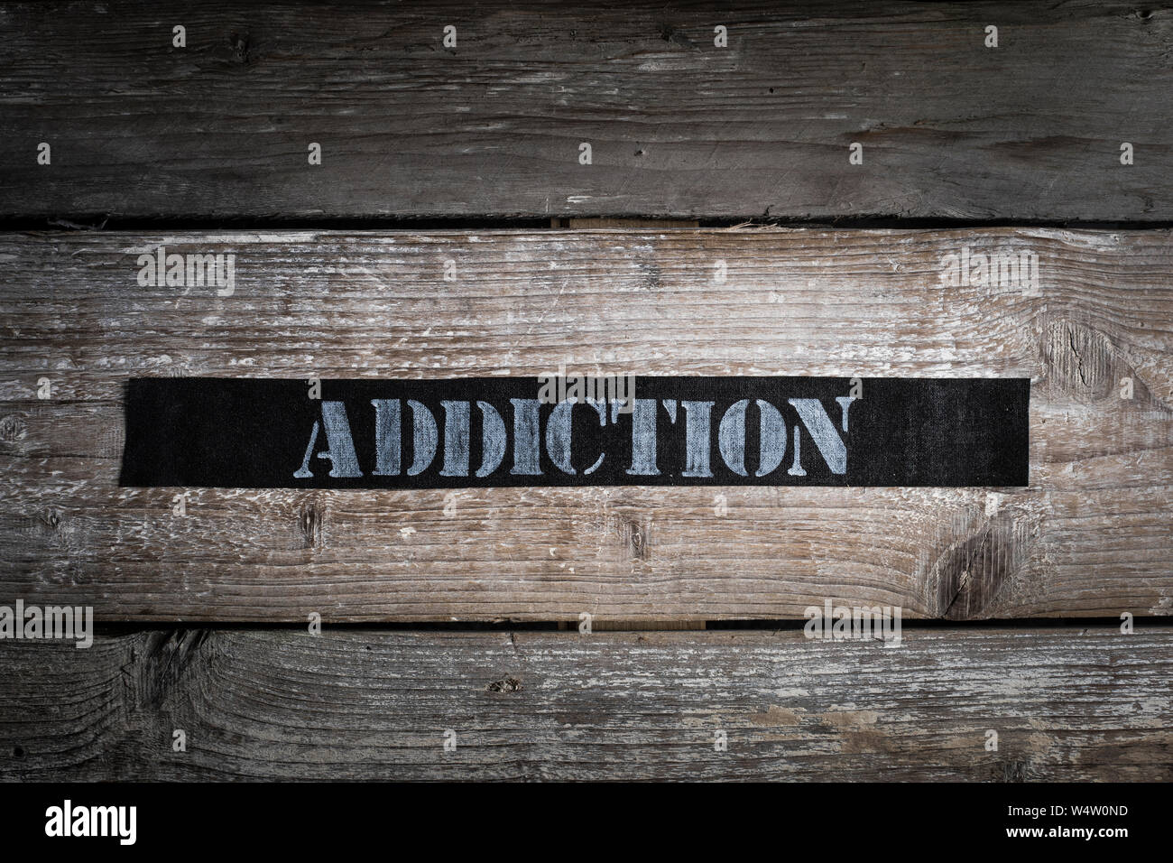 Addiction title on wood background Stock Photo - Alamy