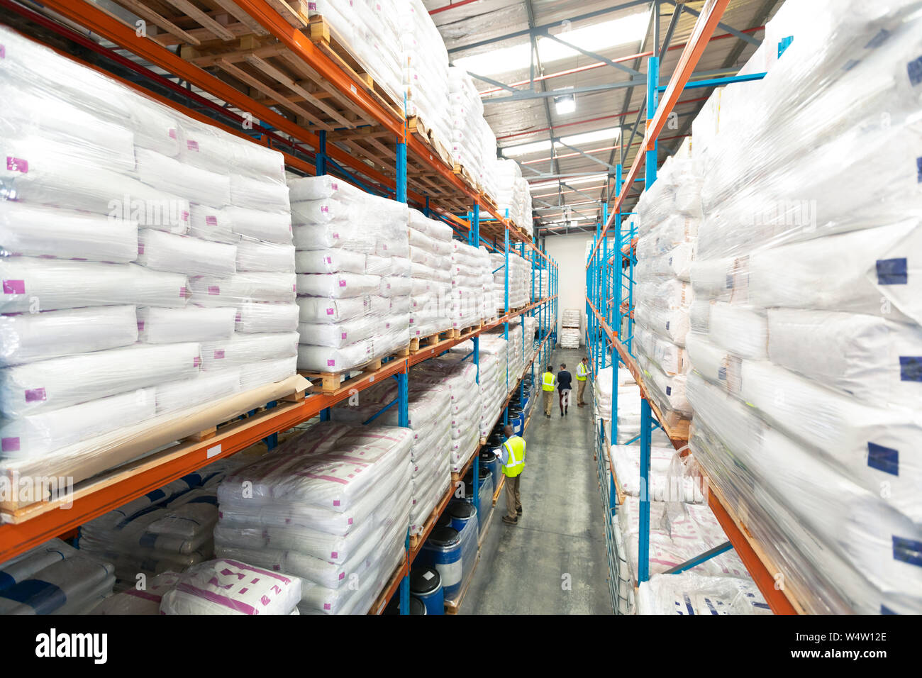 Warehouse staff working together in warehouse Stock Photo - Alamy