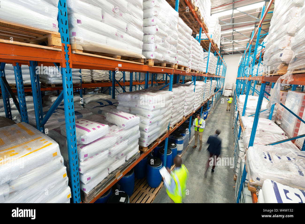 Warehouse staff checking stocks in warehouse Stock Photo - Alamy