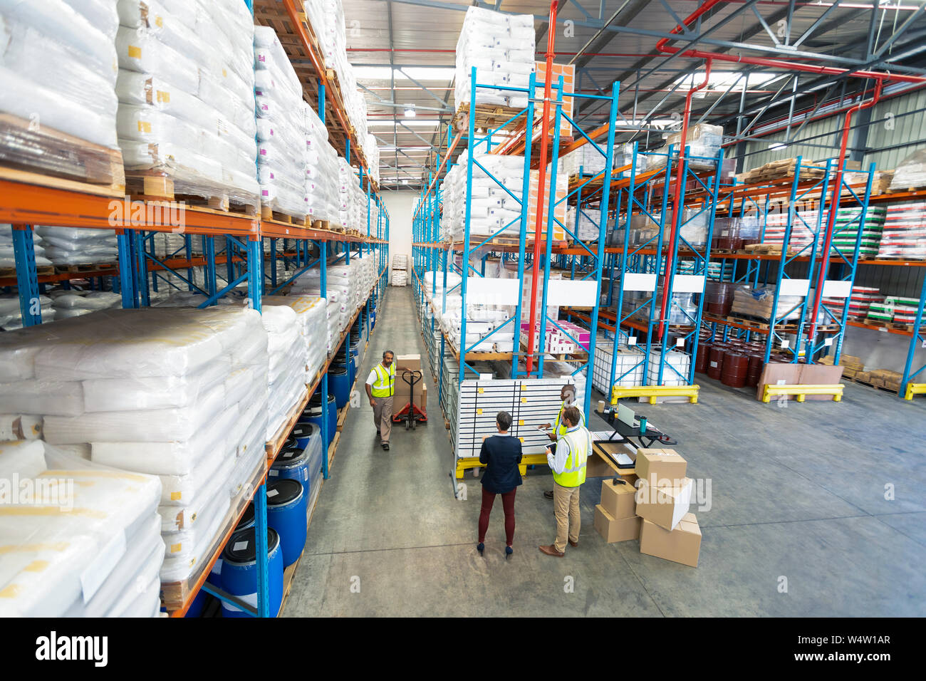 Warehouse staff working together in warehouse Stock Photo - Alamy
