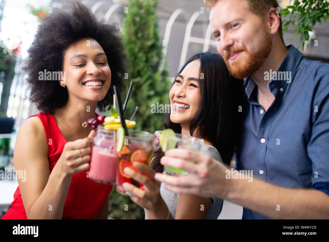 Group of friends having fun together. People talking laughing and ...