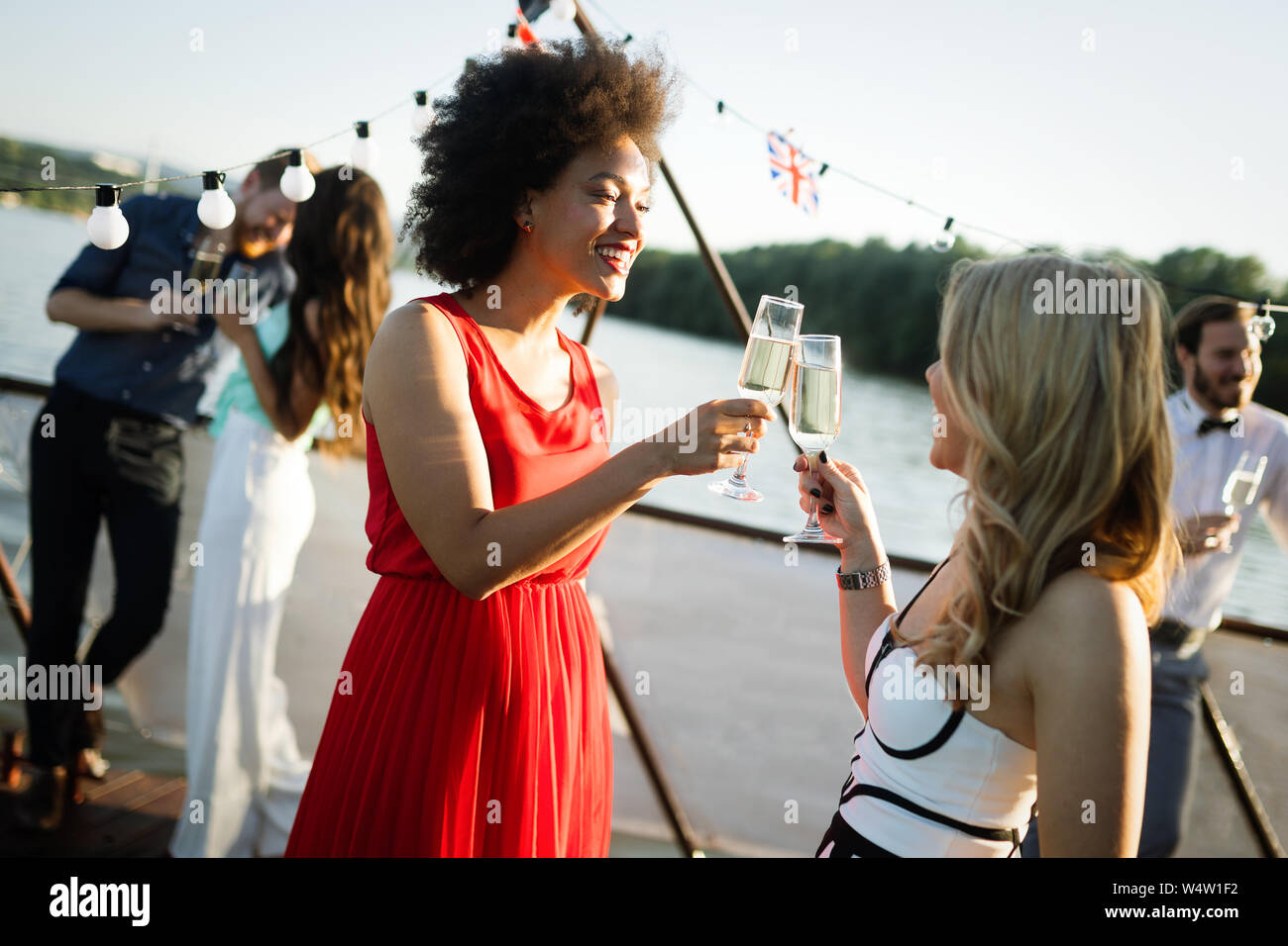 Group of friends having fun and celebrating group gathering Stock Photo ...