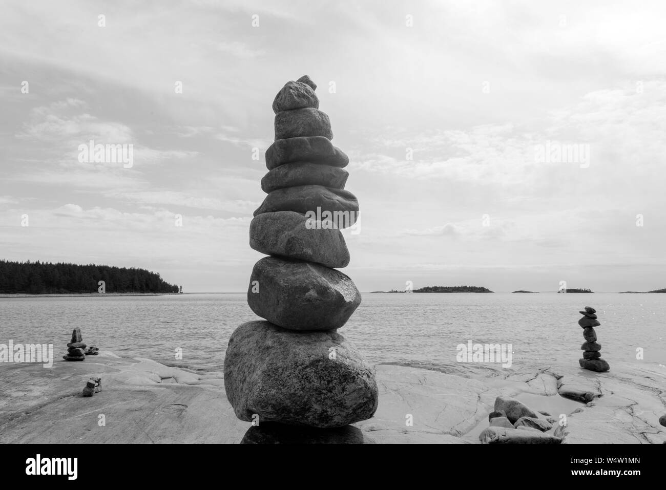 Stacked Rocks balancing, stacking with precision. Stone tower on the ...