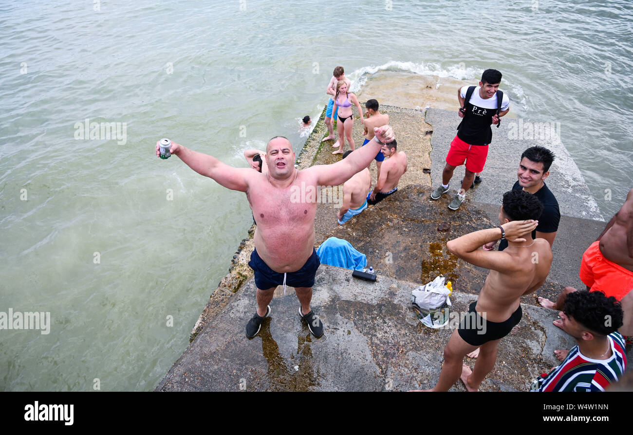 Man showing his muscles beach hi-res stock photography and images - Alamy