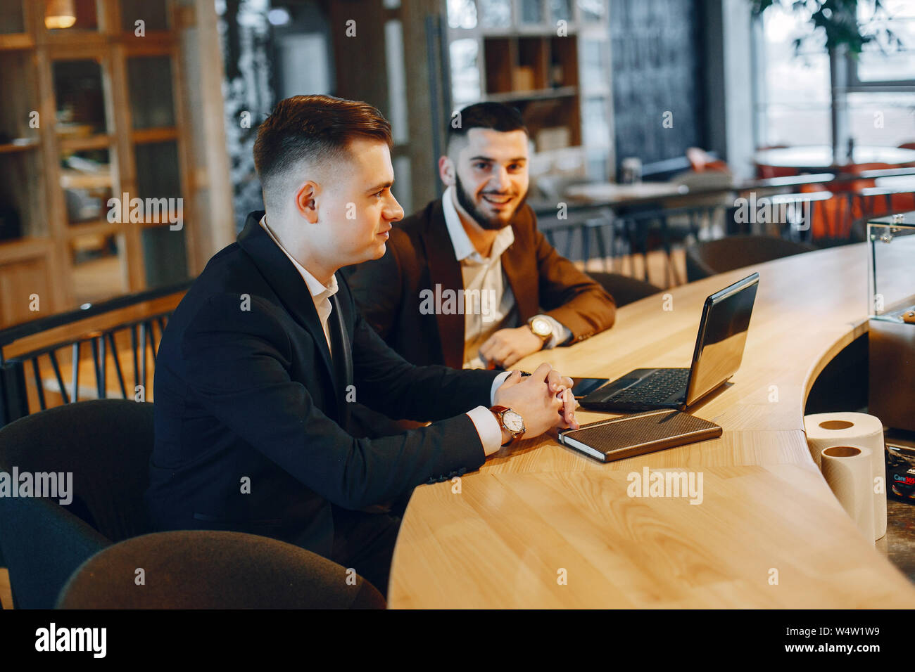 Two successful businessmen sitting computer hi-res stock photography ...