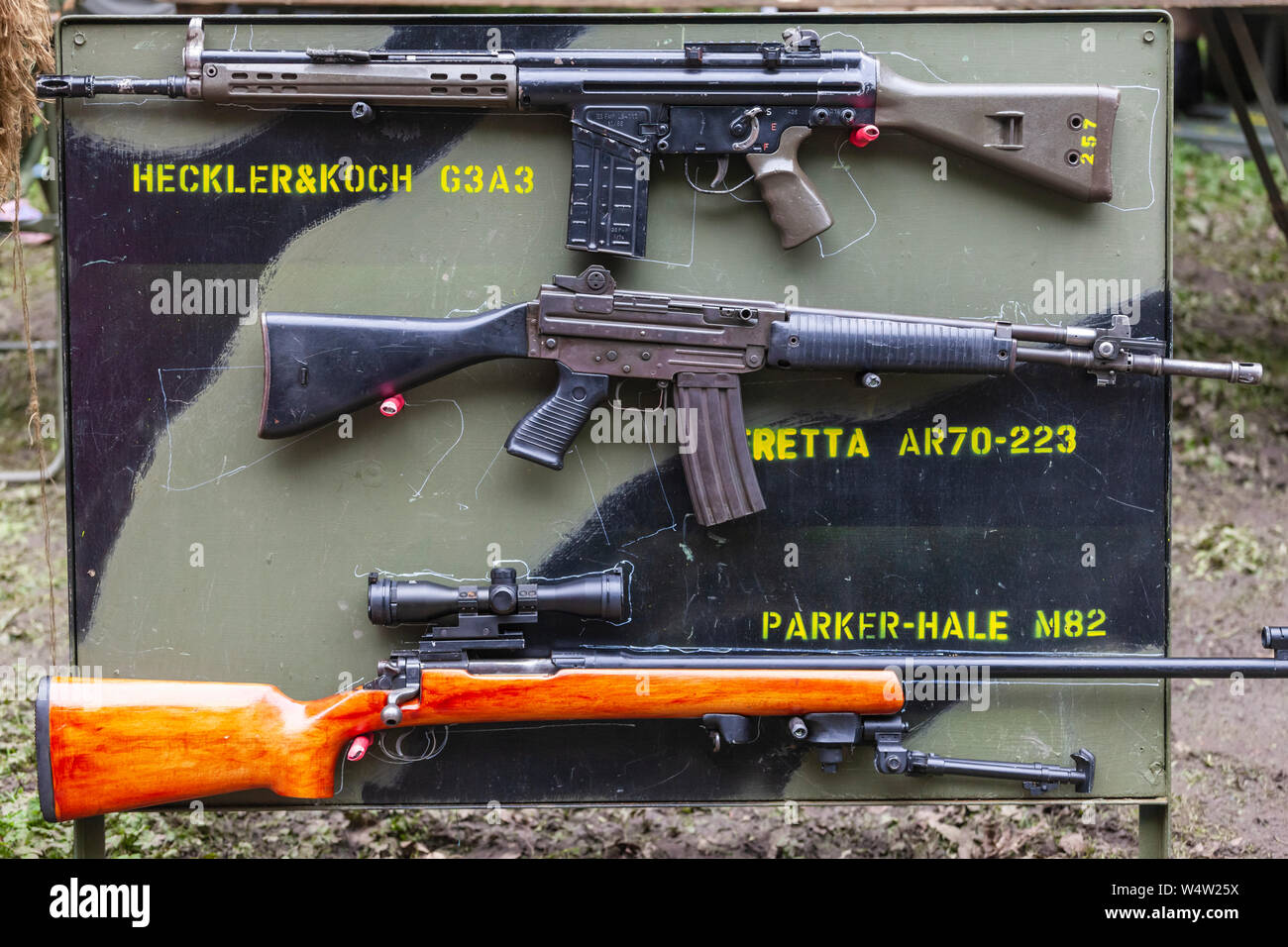 Modern rifles on display at an outdoor event in the grounds of the ...