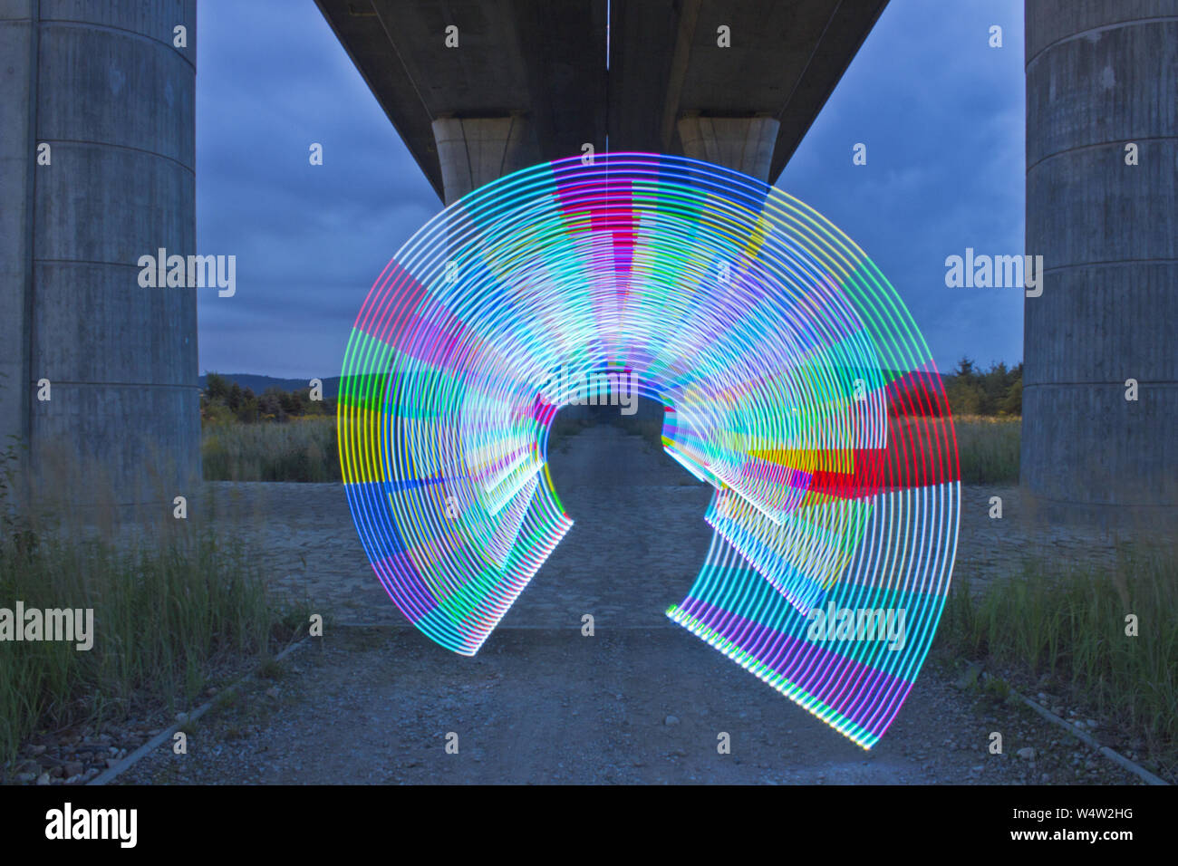 Light painting / light drawing spining colorful circle Stock Photo - Alamy