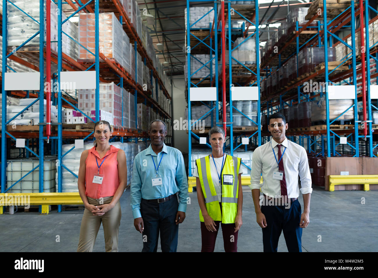Warehouse staffs standing together in warehouse Stock Photo - Alamy