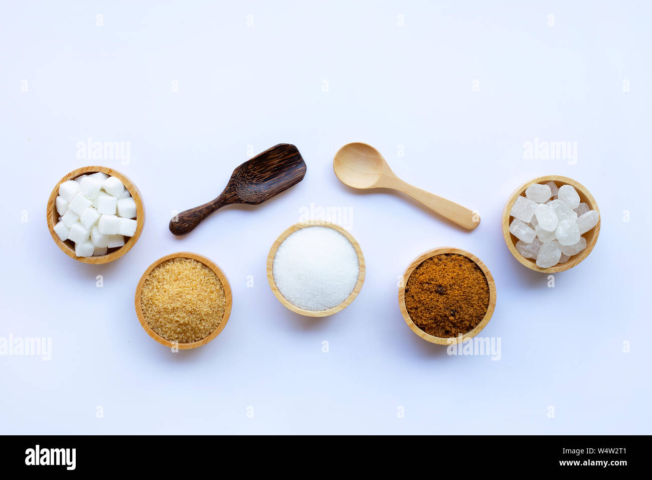 Various types of sugar on white background Stock Photo - Alamy