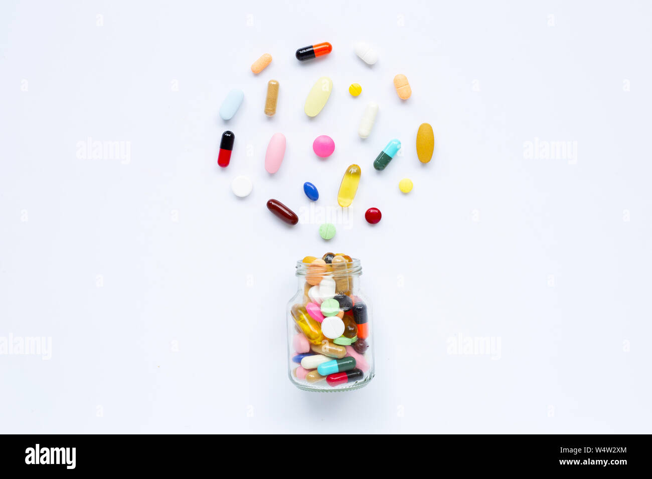 Colorful tablets with capsules and pills on white background Stock ...