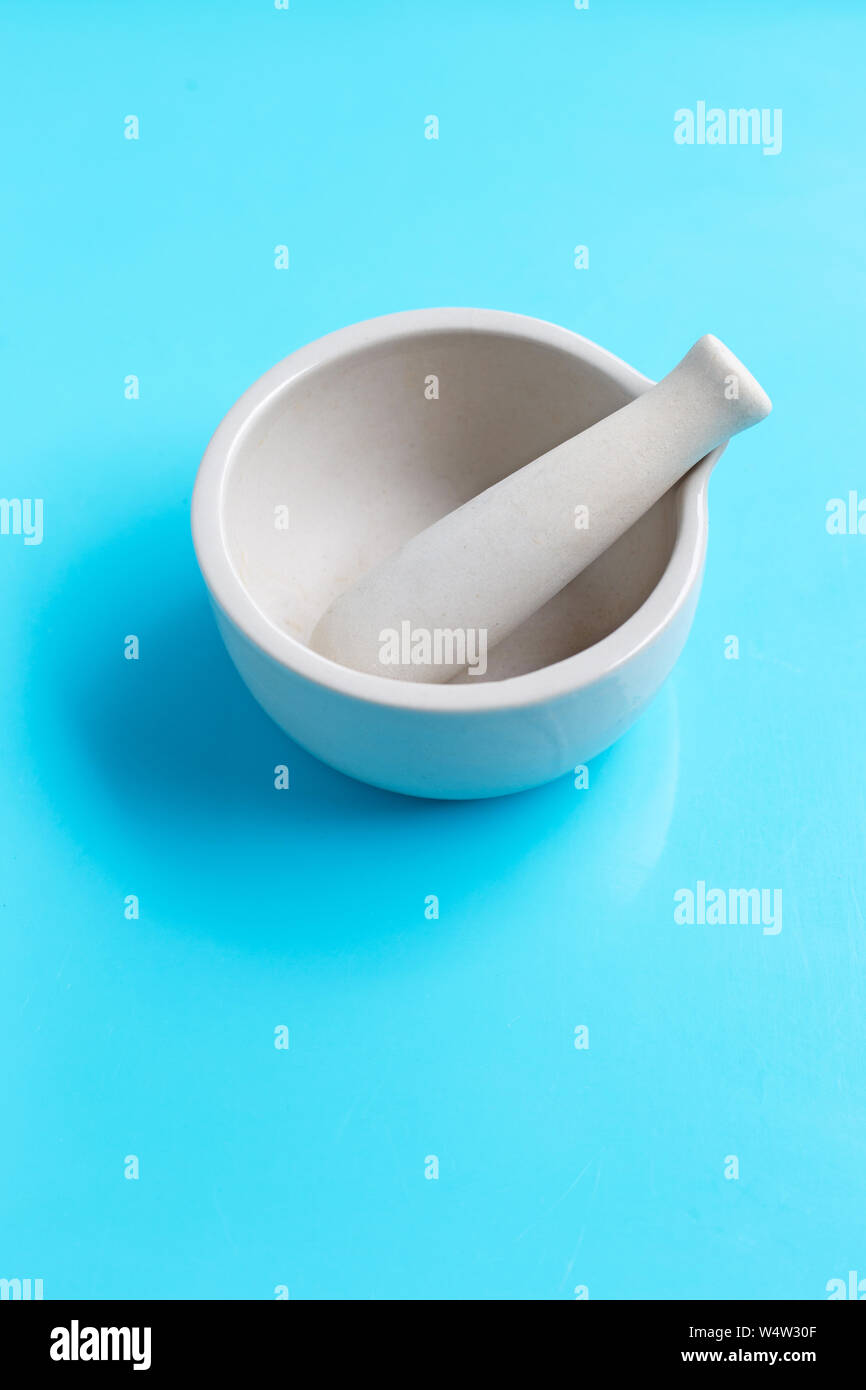 Mortar pestle on blue hi-res stock photography and images - Alamy
