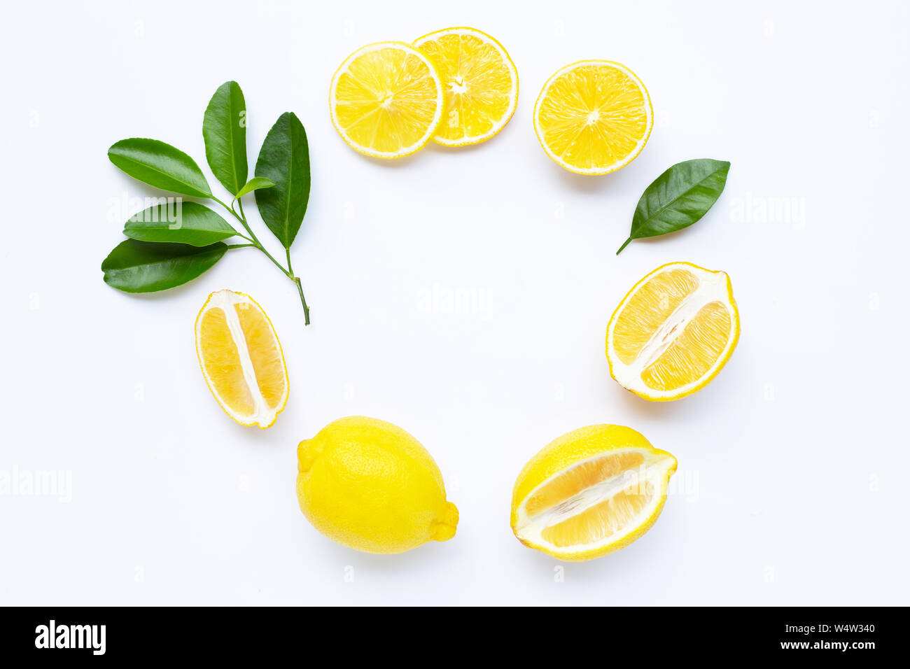lemon and slices with leaves isolated on white background Stock Photo ...