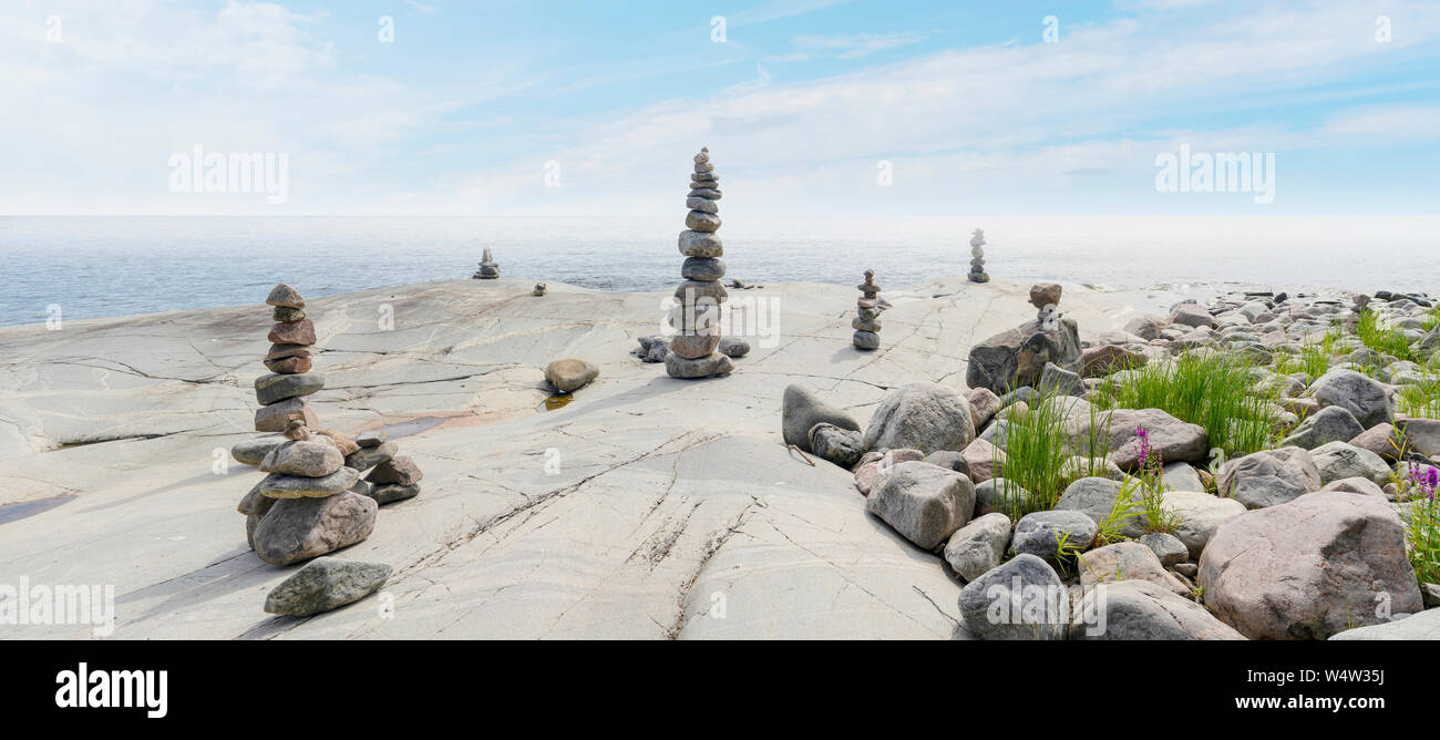 Stacked Rocks balancing, stacking with precision. Stone tower on the ...