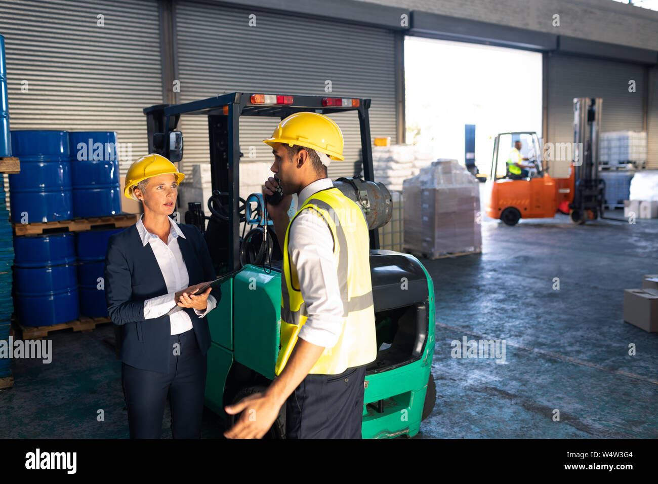 Female manager and male supervisor interacting with each other in ...