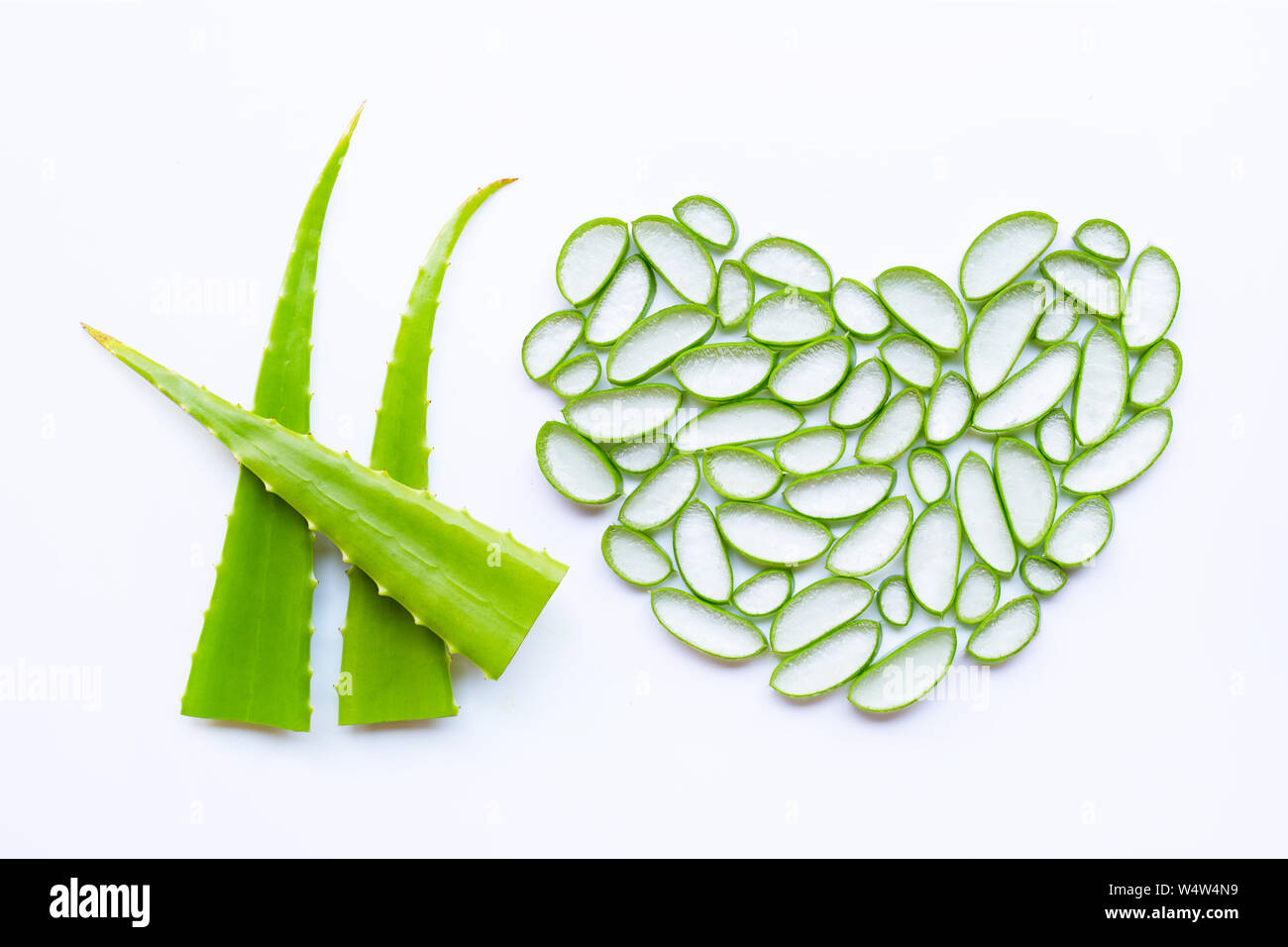 Cut Aloe Vera leaves with slices on white background Stock Photo - Alamy