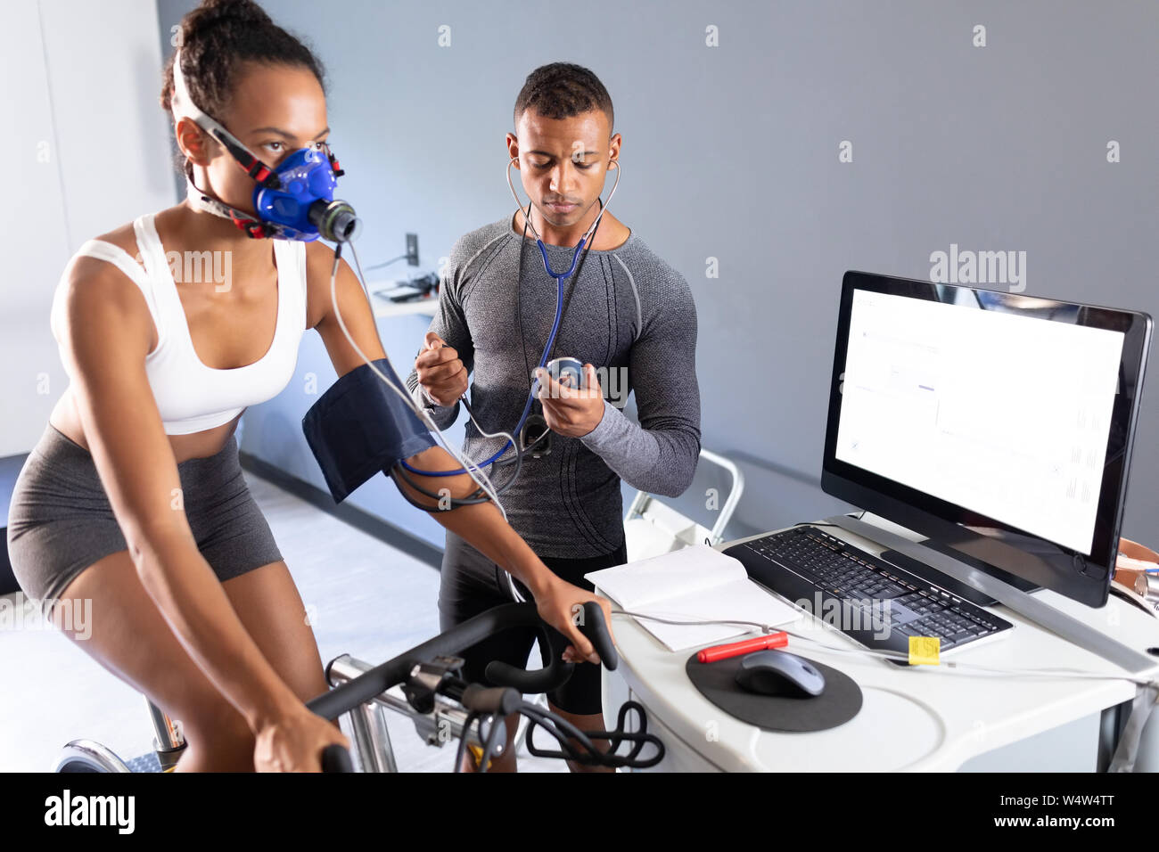 Woman doing a fitness test Stock Photo - Alamy