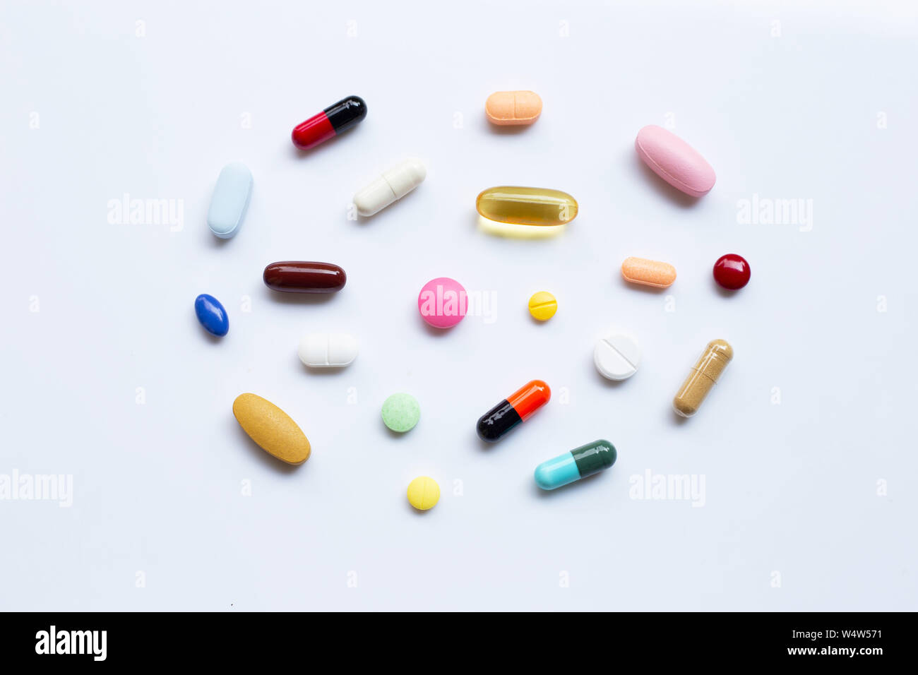 Colorful tablets with capsules and pills on white background Stock ...