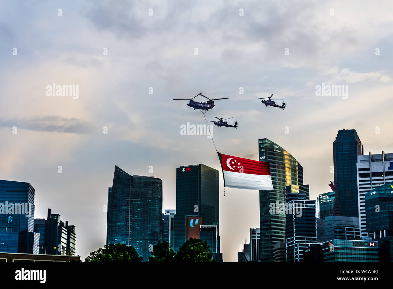 Singapore - Jul 14, 2018: Chinook flying a giant Singapore flag ...
