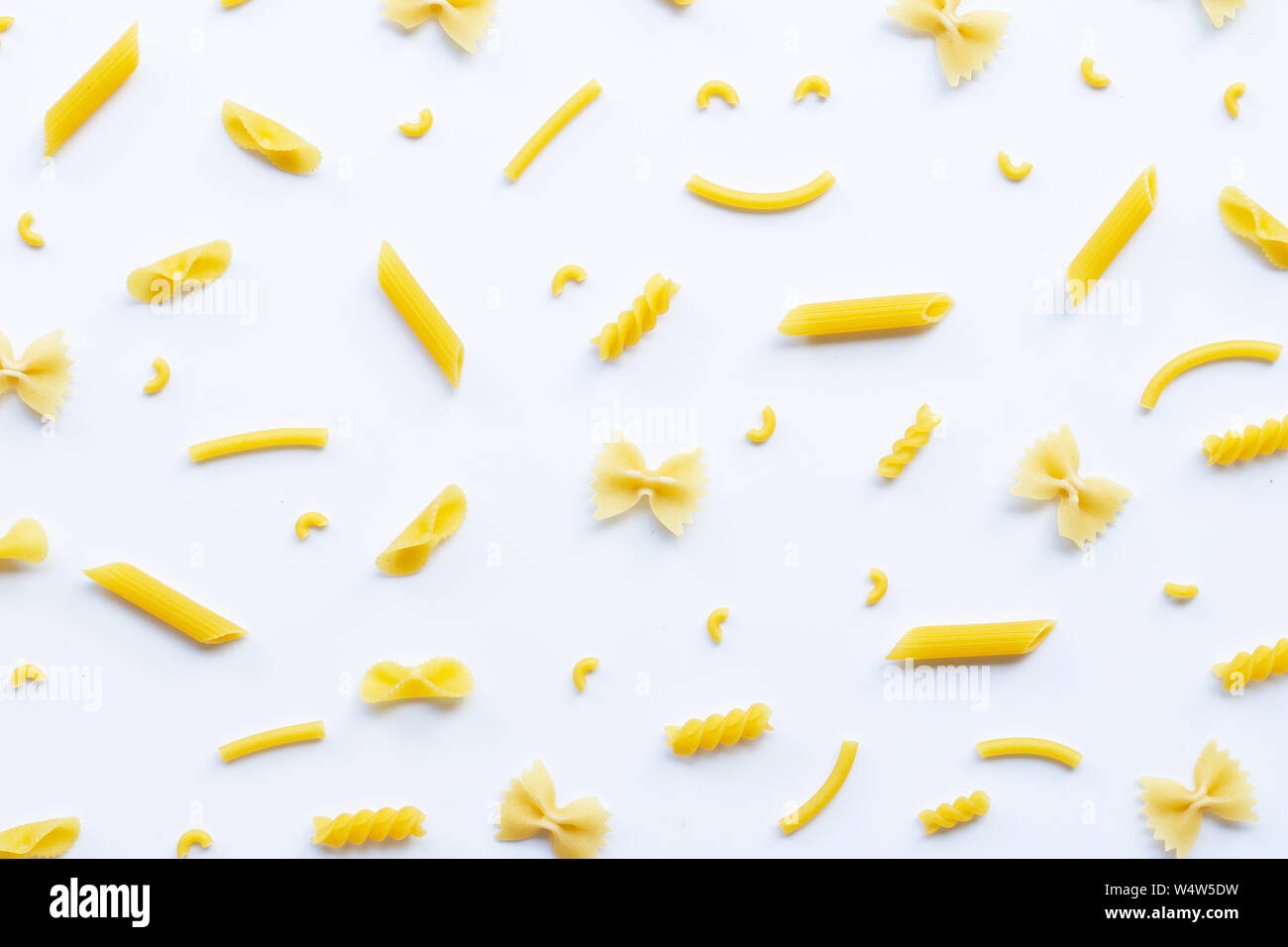Different types of dry pasta on white background Stock Photo - Alamy
