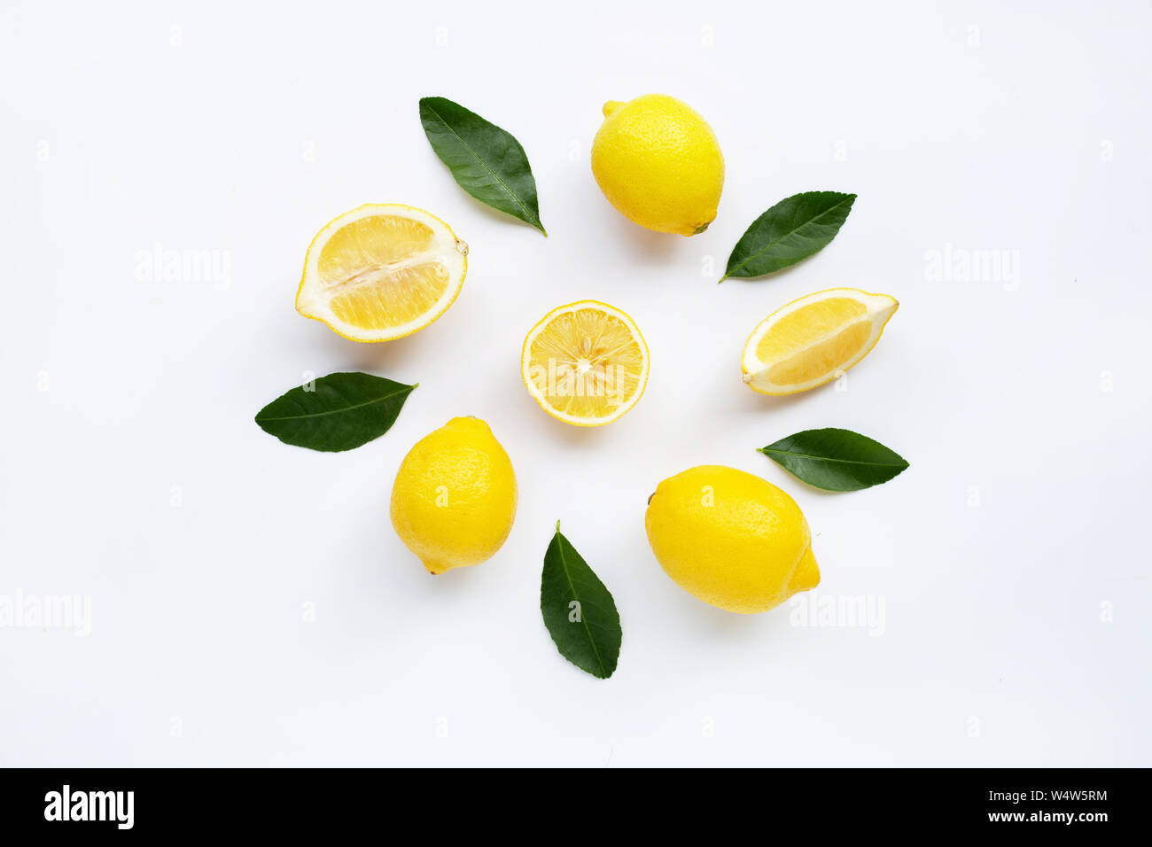 lemon and slices with leaves isolated on white background Stock Photo - Alamy