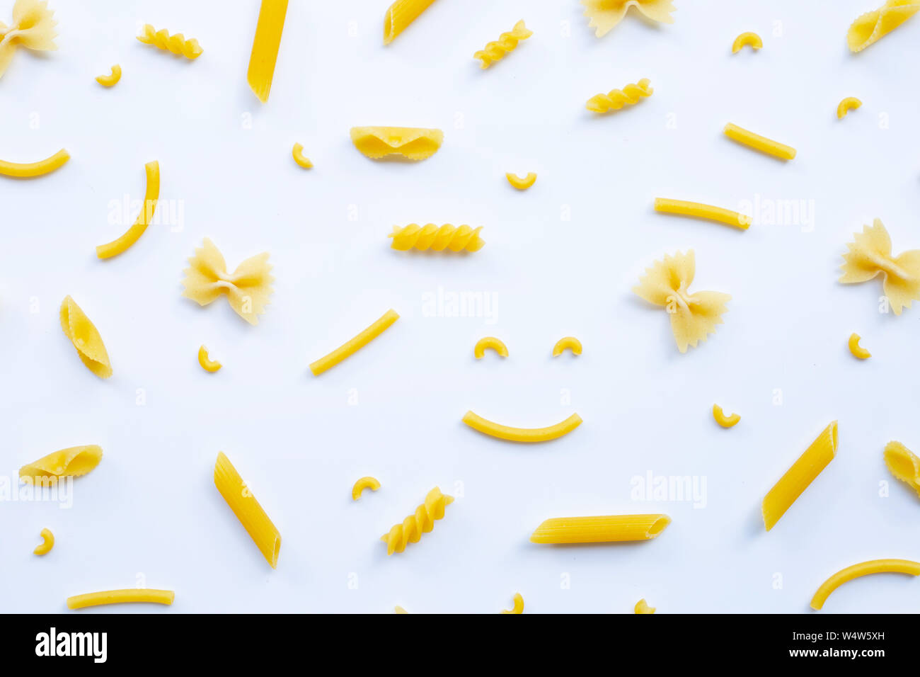 Different types of dry pasta on white background Stock Photo - Alamy