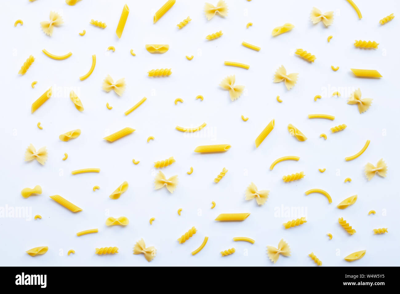 Different types of dry pasta on white background Stock Photo - Alamy