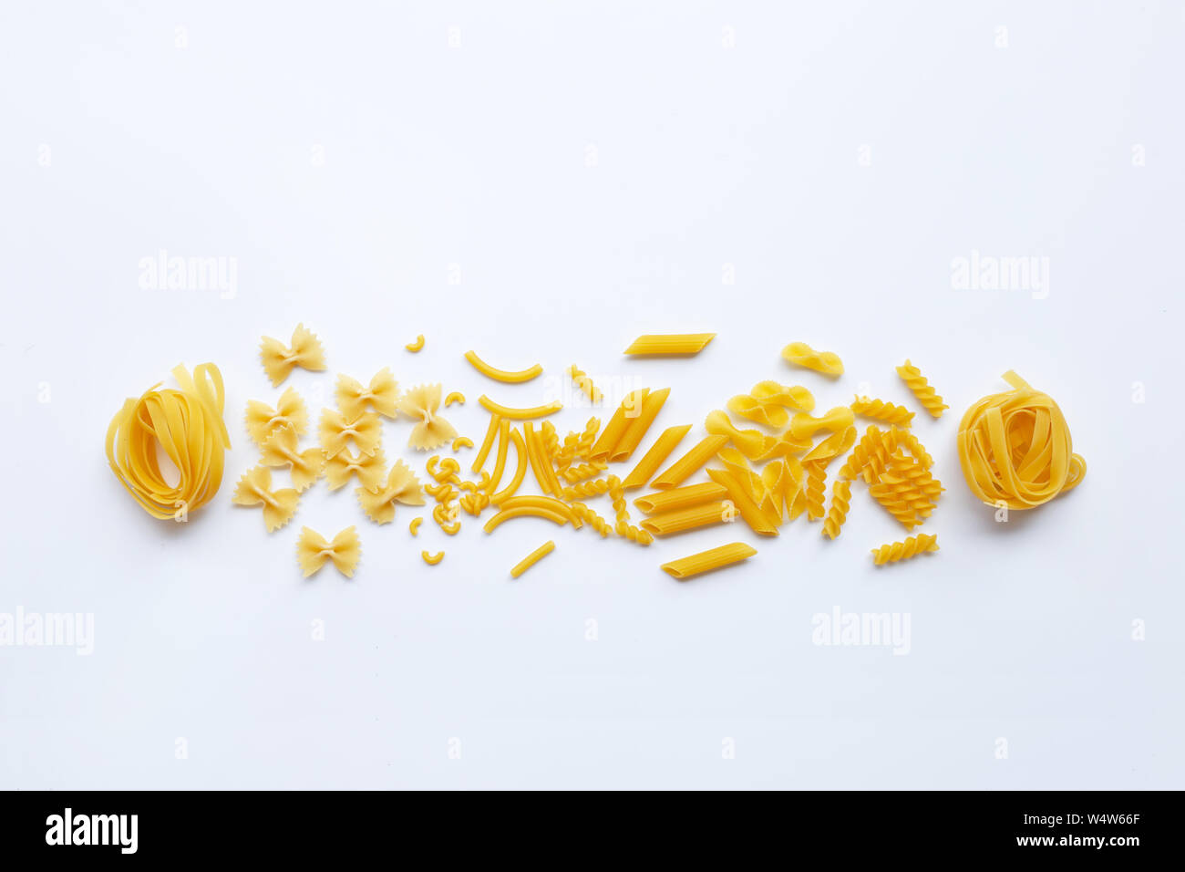 Different types of dry pasta on white background Stock Photo - Alamy