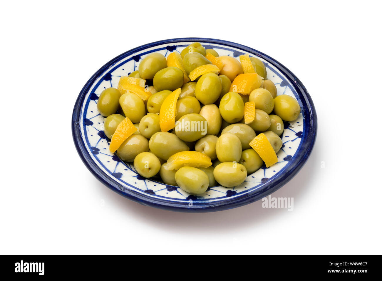 Dish with traditional Moroccan olives and lemon isolated on white ...