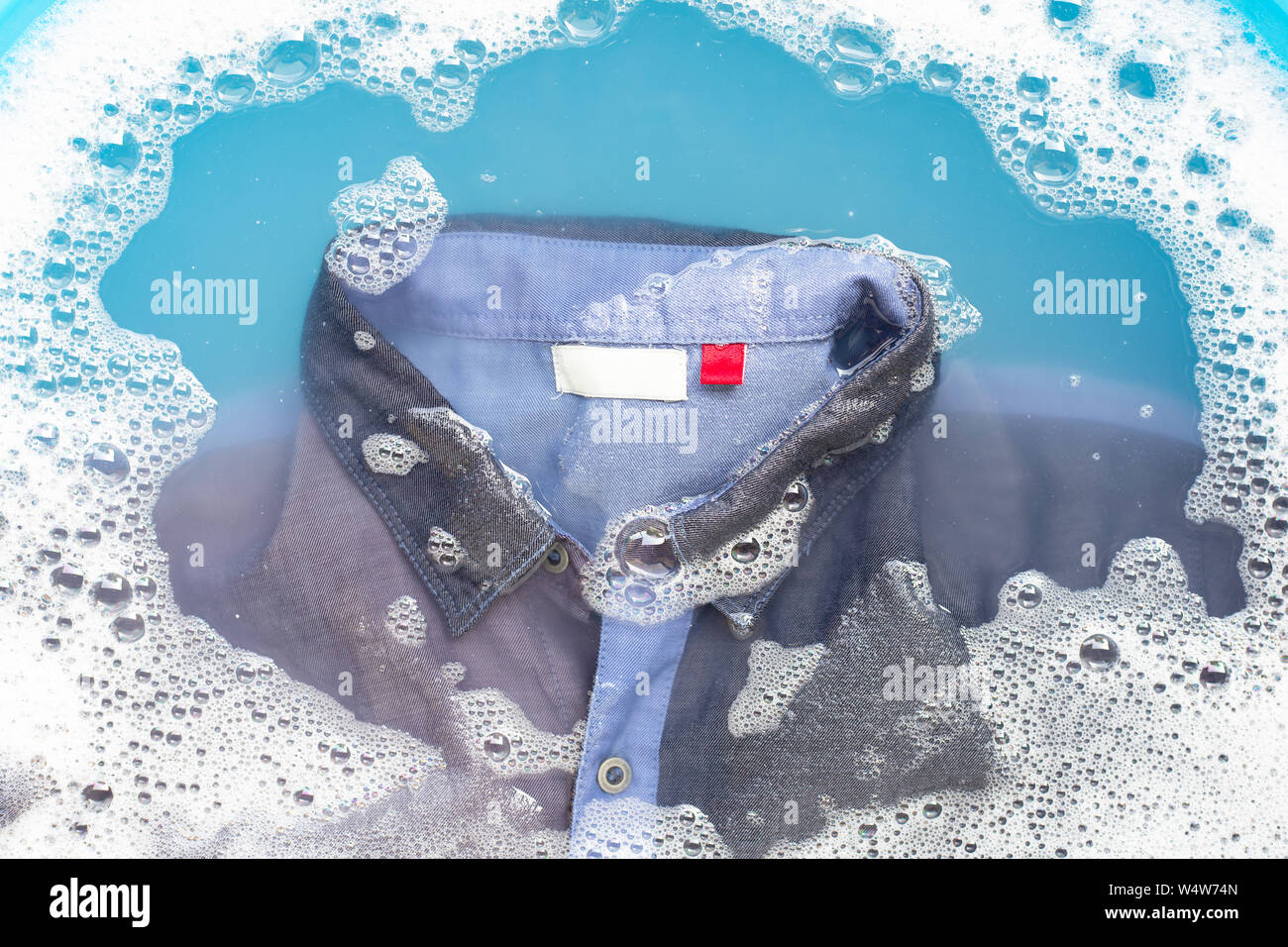 Shirt soak in powder detergent water dissolution, washing cloth ...