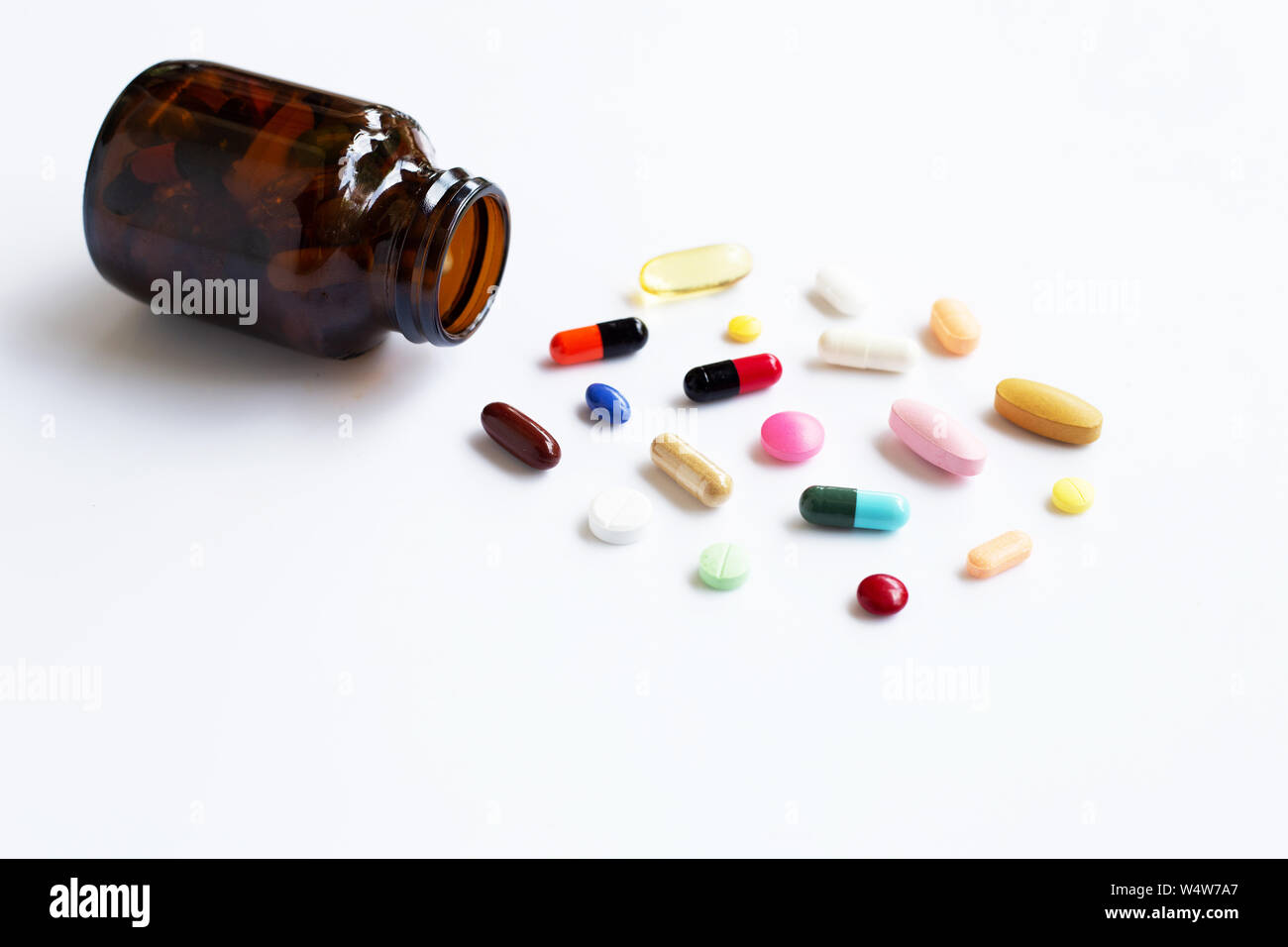 Colorful tablets with capsules and pills on white background Stock ...