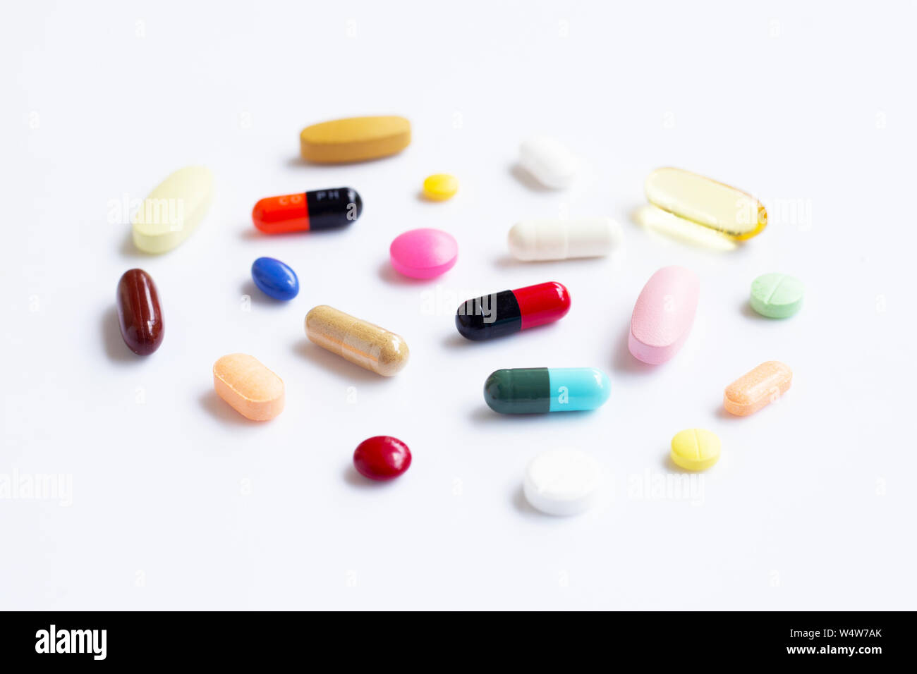 Colorful tablets with capsules and pills on white background Stock ...