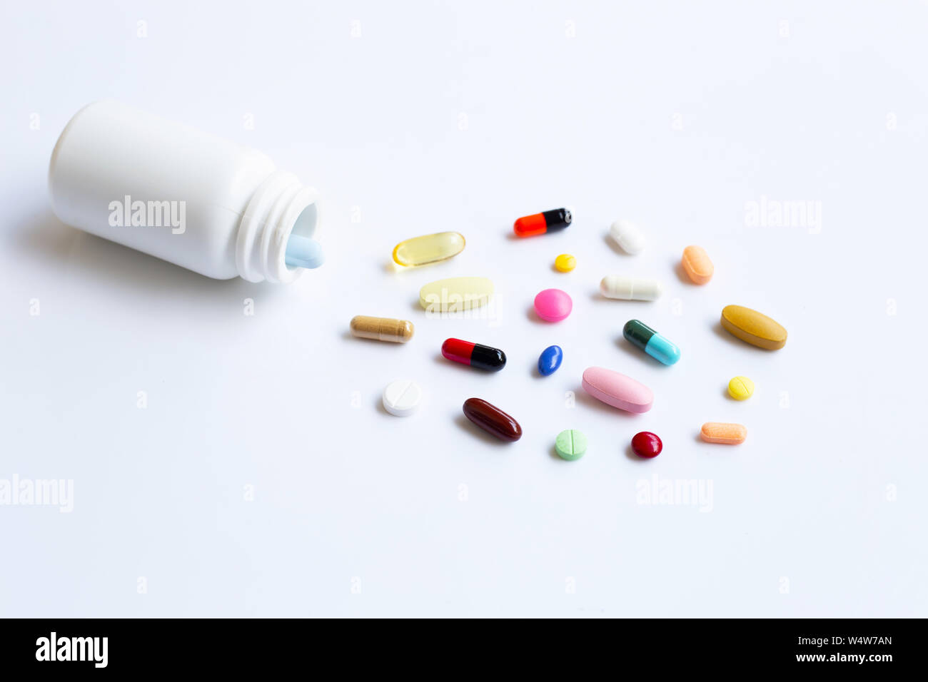 Colorful tablets with capsules and pills on white background Stock ...