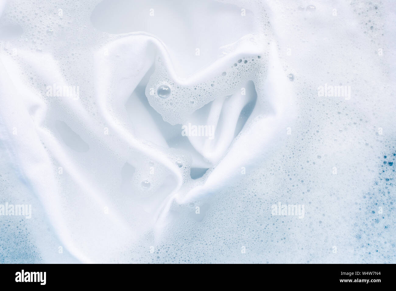 Soak a cloth before washing, white cloth. Top view Stock Photo - Alamy
