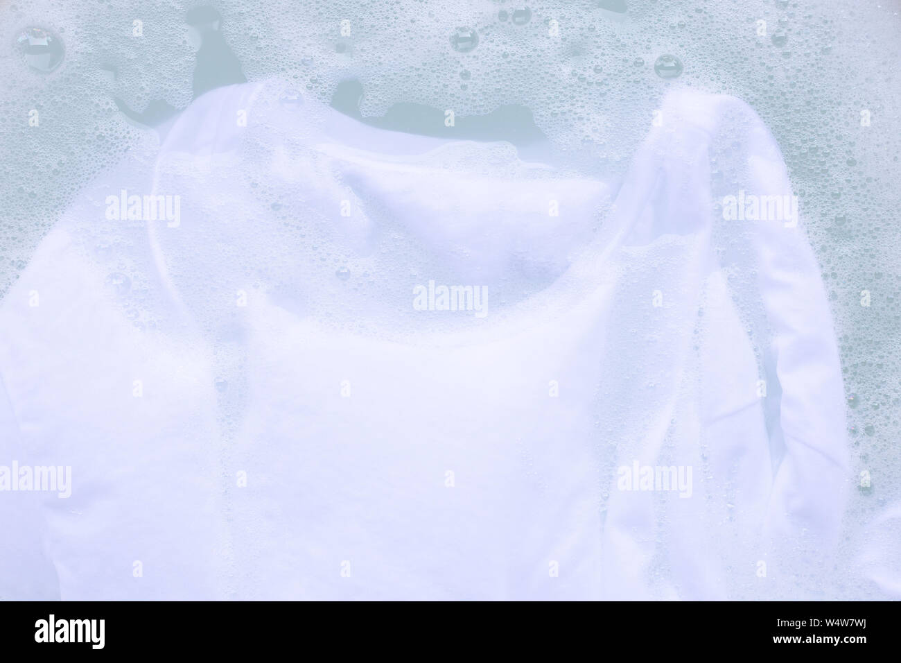 Soak a cloth before washing, white T-shirt Stock Photo - Alamy