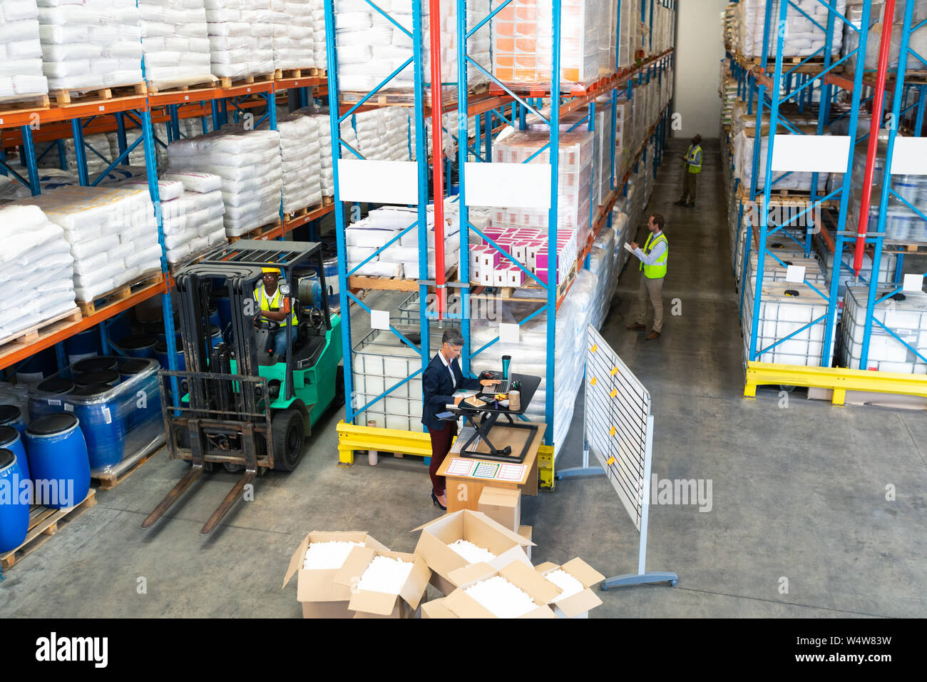 Warehouse staff working together in warehouse Stock Photo - Alamy