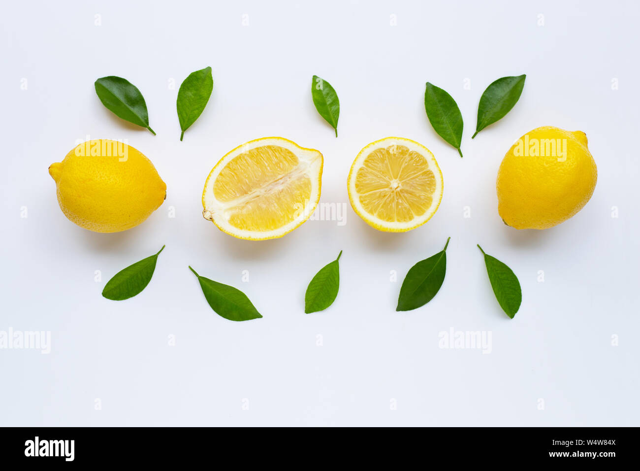 lemon and slices with leaves isolated on white background Stock Photo ...