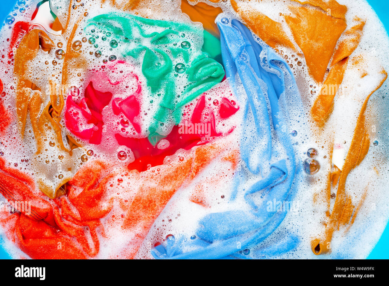 Color clothes soak before washing. Top view Stock Photo - Alamy