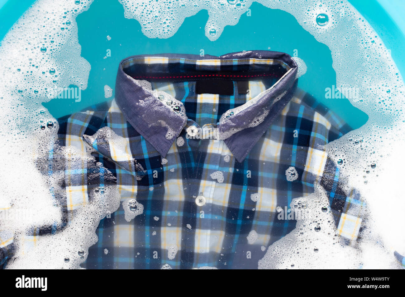 Shirt soak in powder detergent water dissolution, washing cloth ...