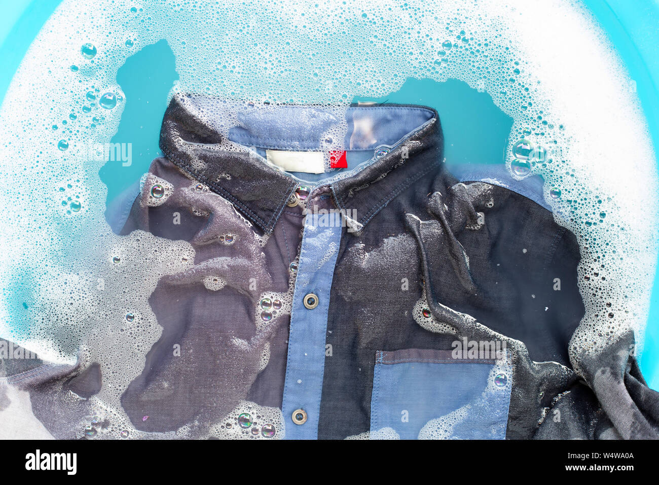 Shirt soak in powder detergent water dissolution, washing cloth ...